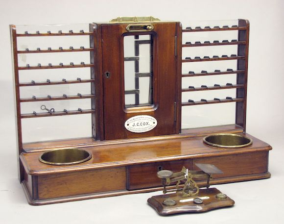 Bonhams : A Victorian brass mounted mahogany money till and a postal scale