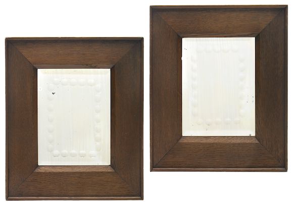 Bonhams : A pair of oak framed small beveled mirrors