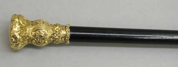 Bonhams : A gold knop ebonized wood walking stick