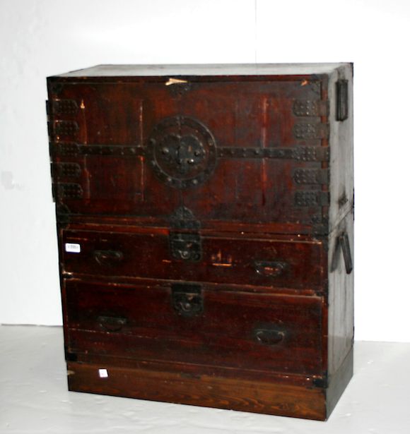 Bonhams : A lacquered kiri wood two-section tansu on a wood stand
