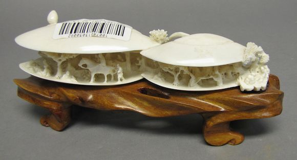 Bonhams : A carved ivory double clam 'dream' with reticulated ...