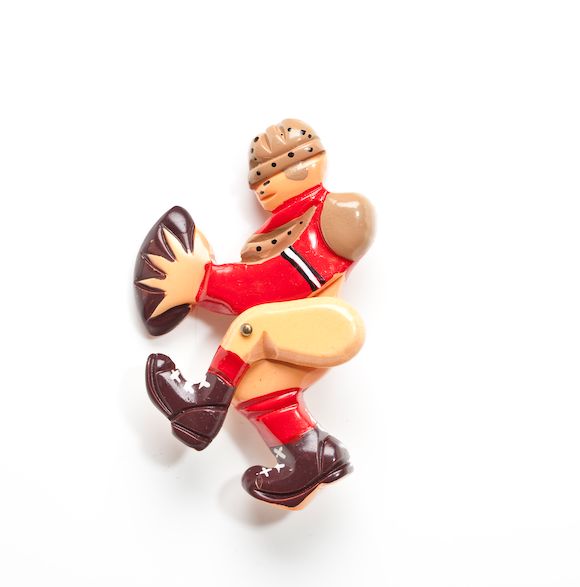 Bonhams : A Bakelite hand painted articulated football player brooch