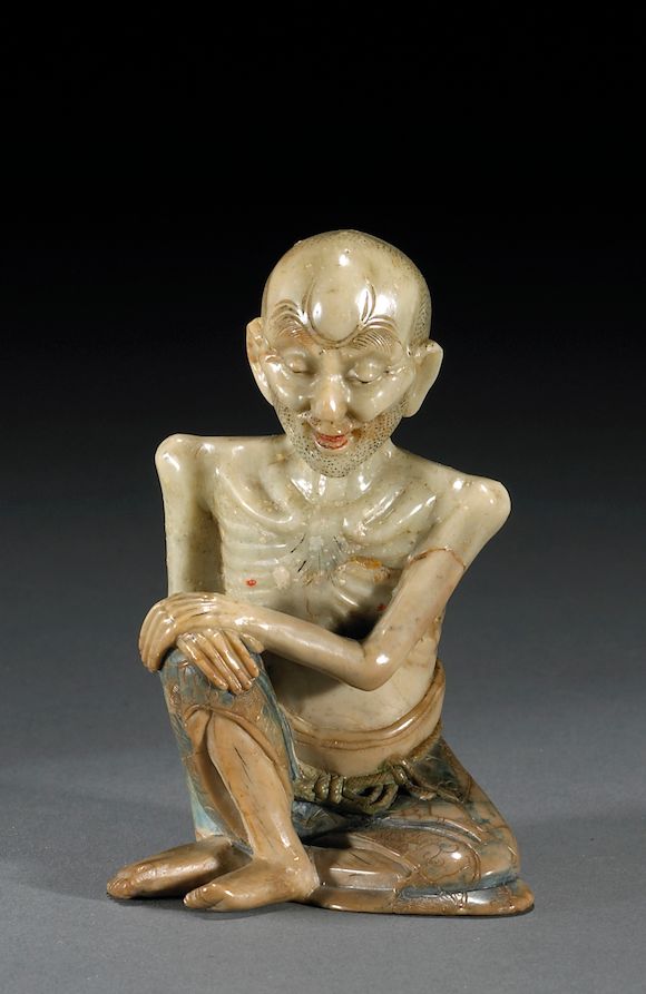 Bonhams : A tinted soapstone figure of a seated ascetic 19th Century