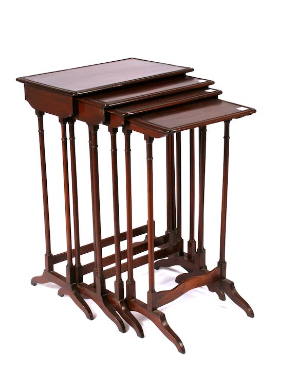 Bonhams : A nest of four Regency style trestle form side tables