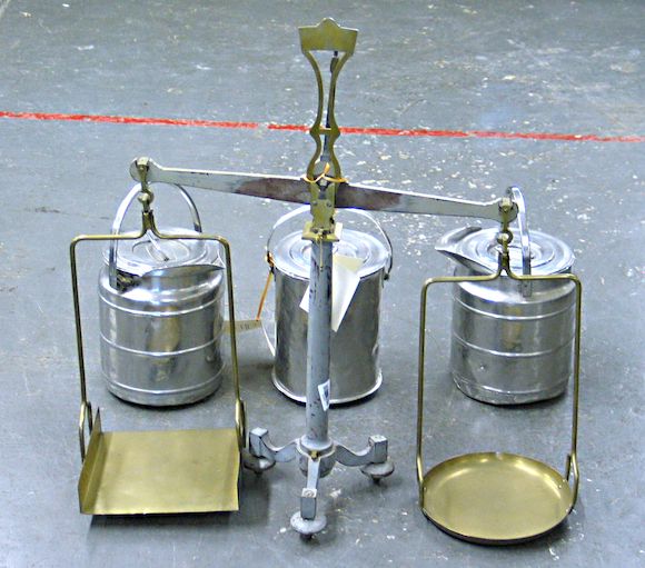 Bonhams : A French brass and iron balance scale and three aluminum milk ...