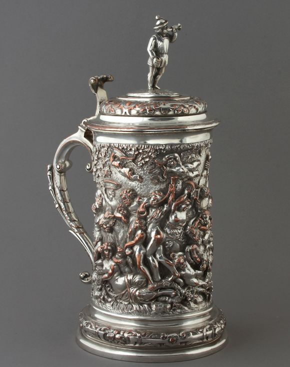 Bonhams : A Victorian silver plated lidded tankard with repousse decoration