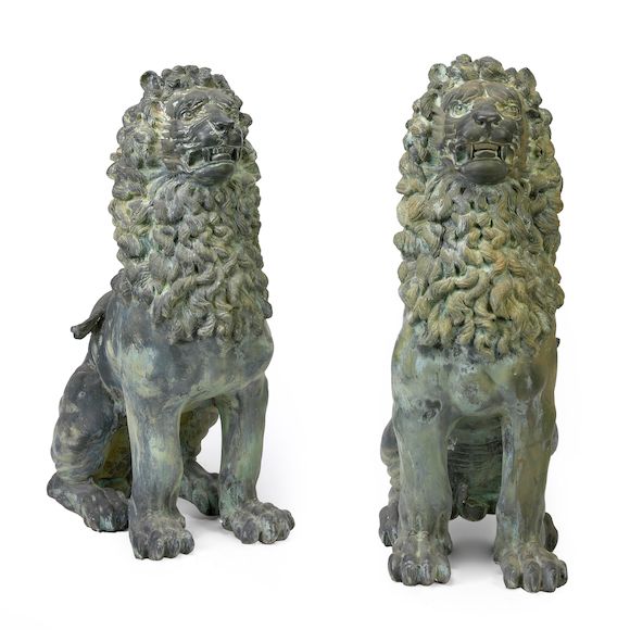 Bonhams : A pair of bronze models of seated lions