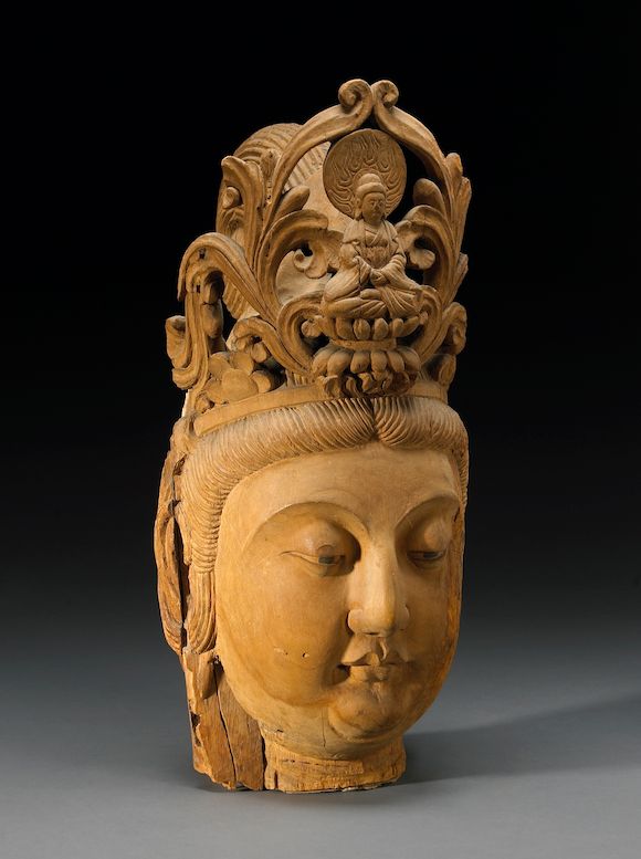 Bonhams : A carved wood head of Guanyin