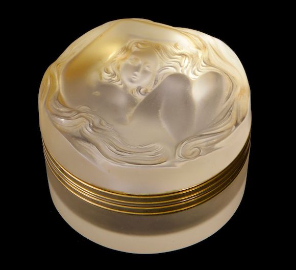 Bonhams : A Lalique molded glass hinged powder box