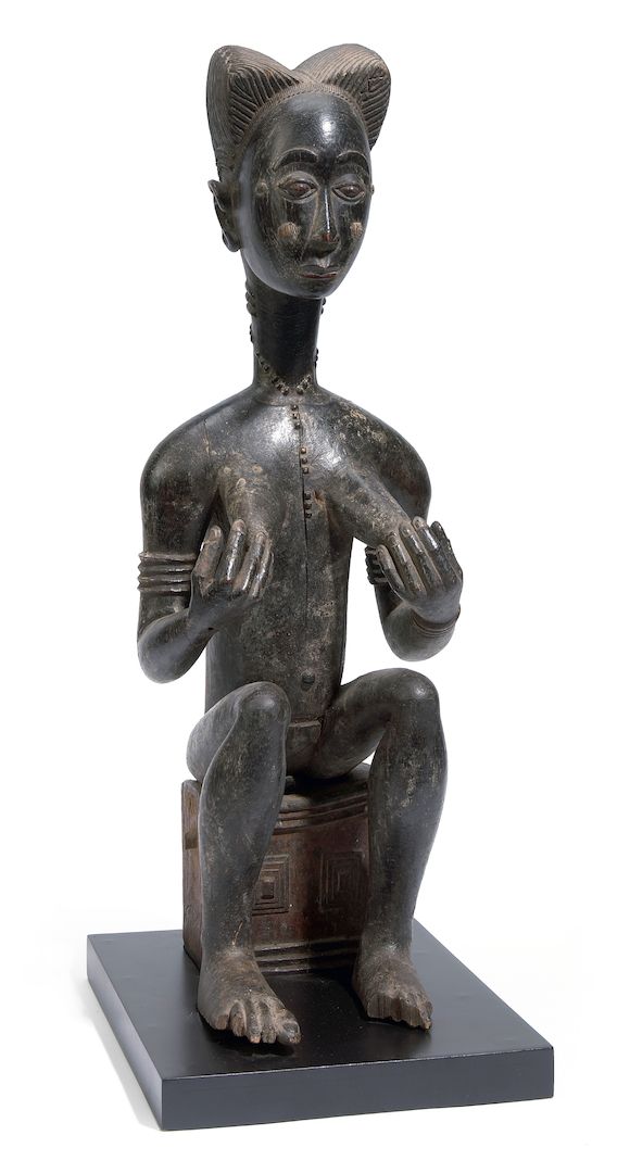 Bonhams : A Baule seated female figure, Ivory Coast