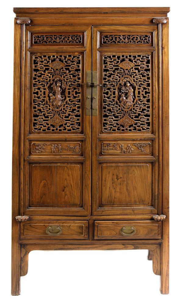 Bonhams : A Chinese tall mixed wood two-door cabinet with carved and ...