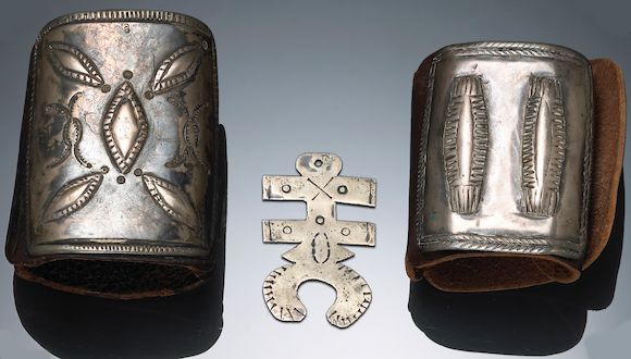 Bonhams : Two Navajo bow guards and a pendant