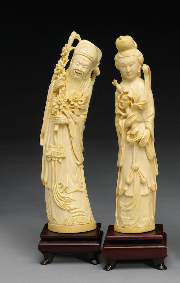 Bonhams A Pair Of Carved Ivory Male And Female Figures 20th Century