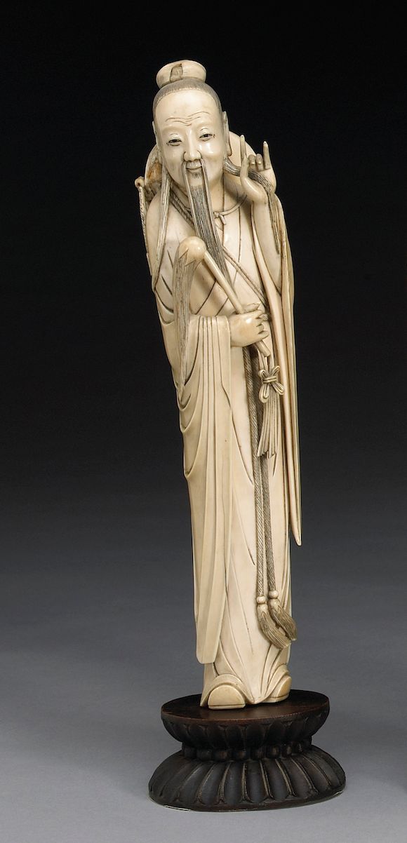 Bonhams : A tinted ivory figure of Lu Dongbin Republic Period