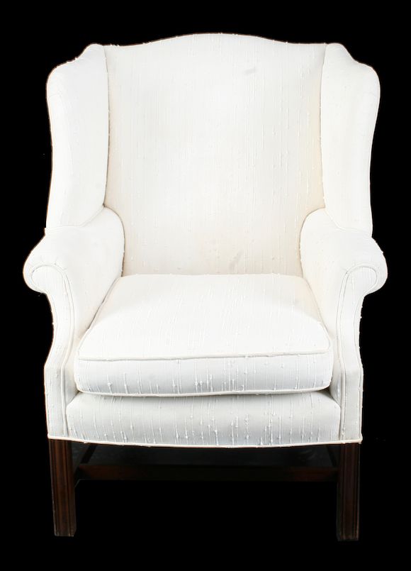 Bonhams : A pair of George III style upholstered mahogany wing armchairs