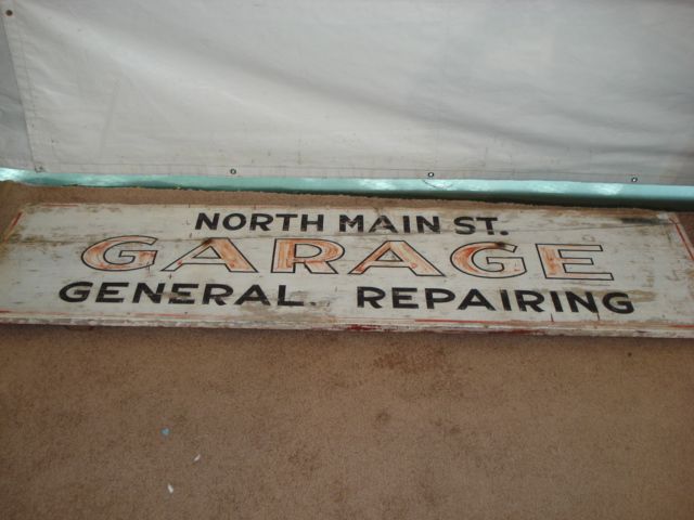Bonhams Cars : A large Garage repair sign,