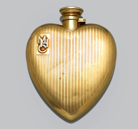 Bonhams : A fourteen karat gold heart-shaped flask, Birks