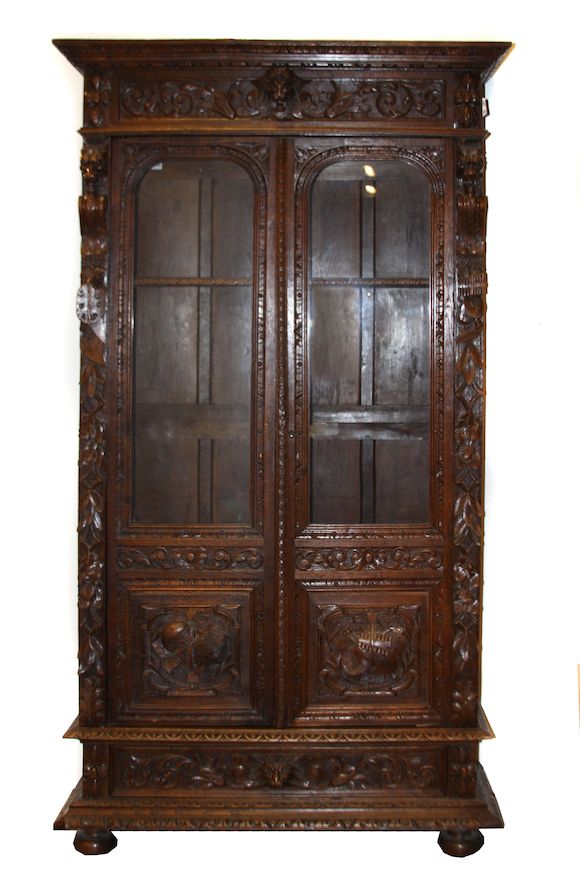Bonhams : A Baroque style carved oak bookcase