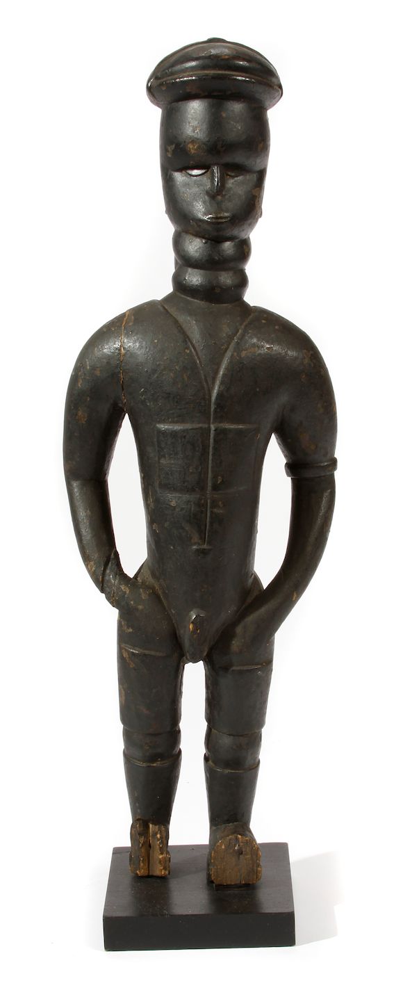 Bonhams : A Mende male standing figure wearing European attire