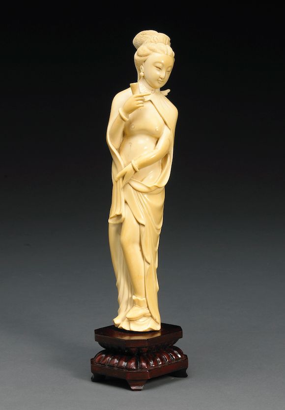 Bonhams : A carved ivory figure of a beauty 20th Century