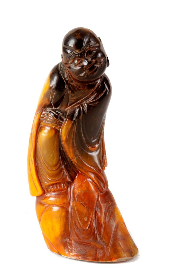 Bonhams : A Chinese carved horn figure of a deity