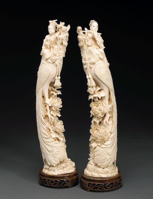 Bonhams : A pair of carved ivory phoenix 20th Century