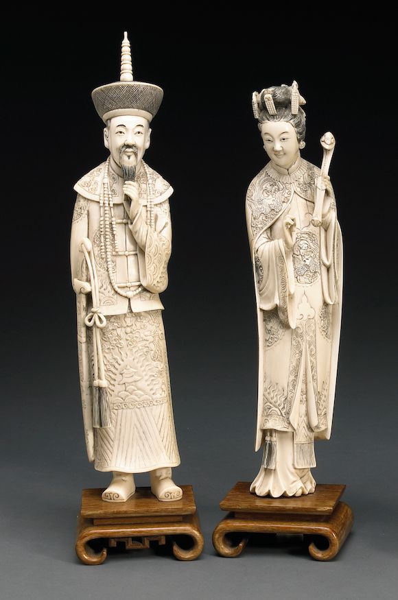 Bonhams : A pair of carved ivory figures depicting an emperor and ...