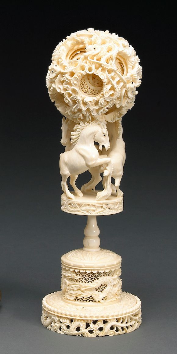 Bonhams : A carved ivory puzzle ball and stand 20th Century