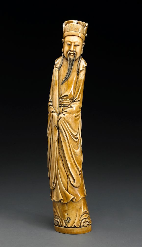 Bonhams : A carved and tinted ivory figure of an official 20th Century