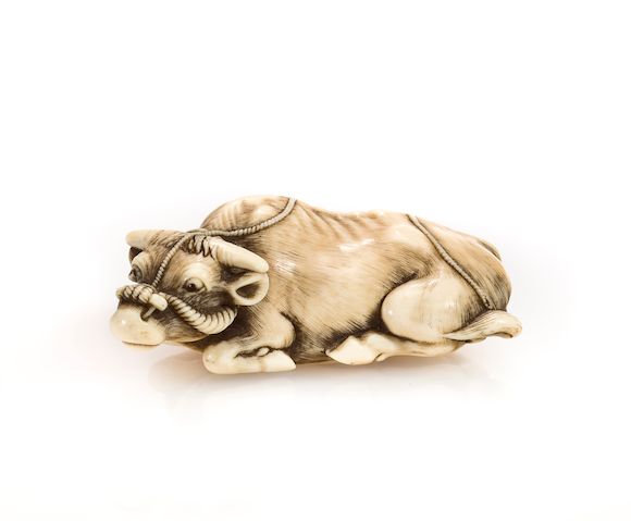 Bonhams : An ivory netsuke of an ox By Tomotada, Edo period, 18th century