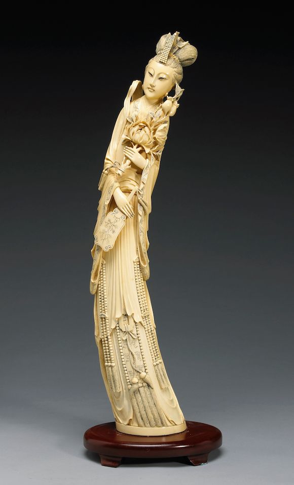 Bonhams : A carved ivory figure of a beauty 20th Century