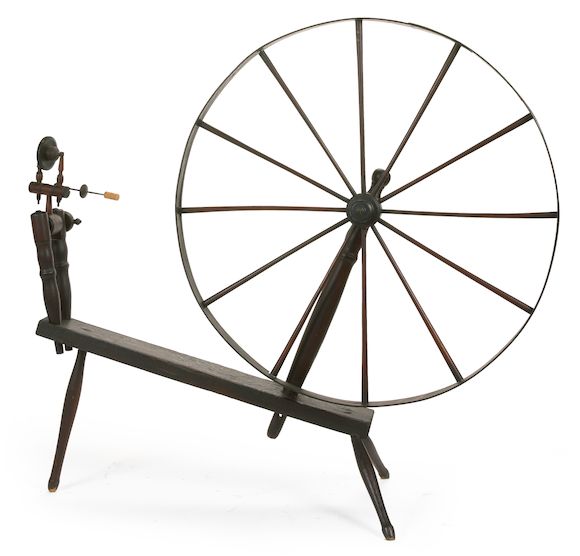 Bonhams : A mixed wood spinning wheel of large size