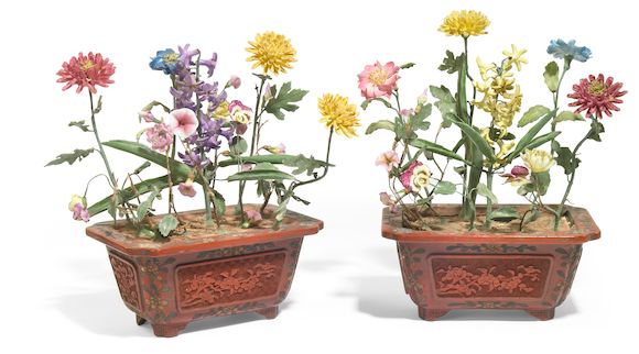 Bonhams : A pair of porcelain flowering plants in Chinese cinnabar ...