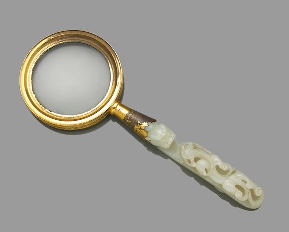 Bonhams : A carved jade belt hook mounted to a magnifying glass The ...