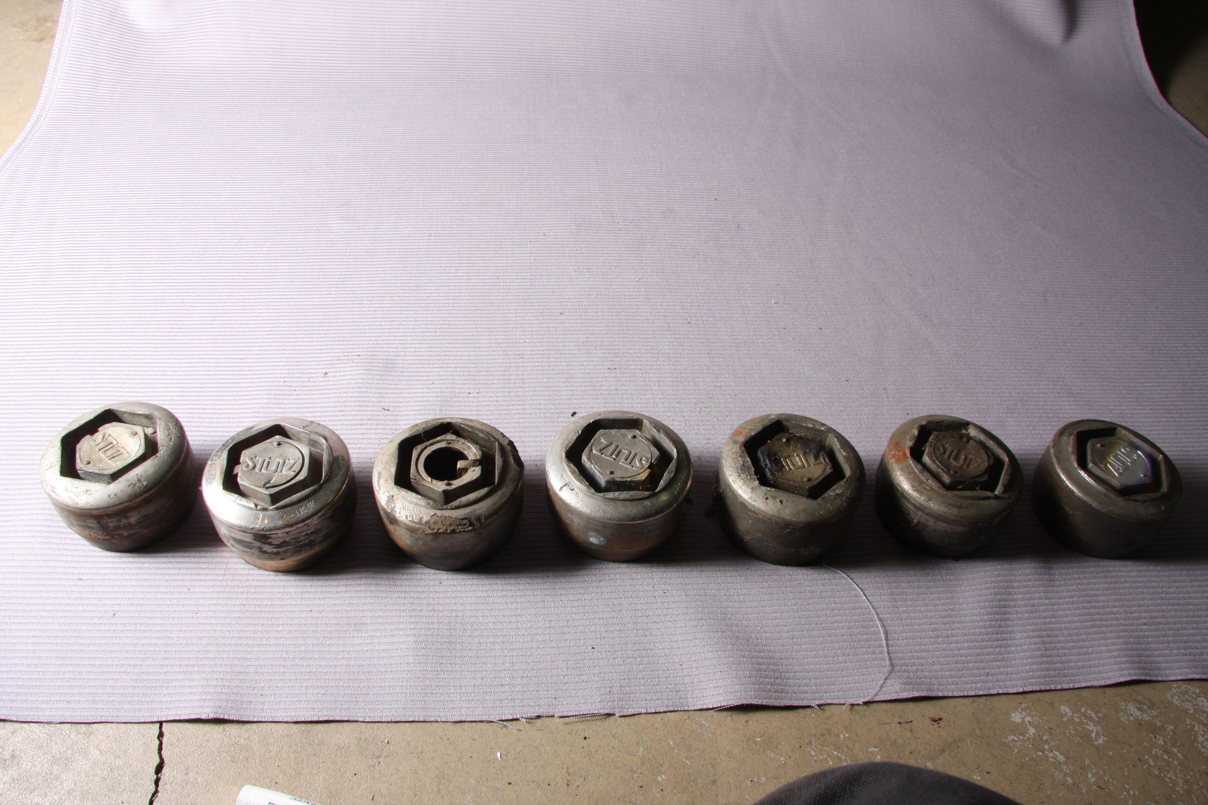 Bonhams Cars : A lot of seven Buffalo small type no. 4 wheel hub caps,