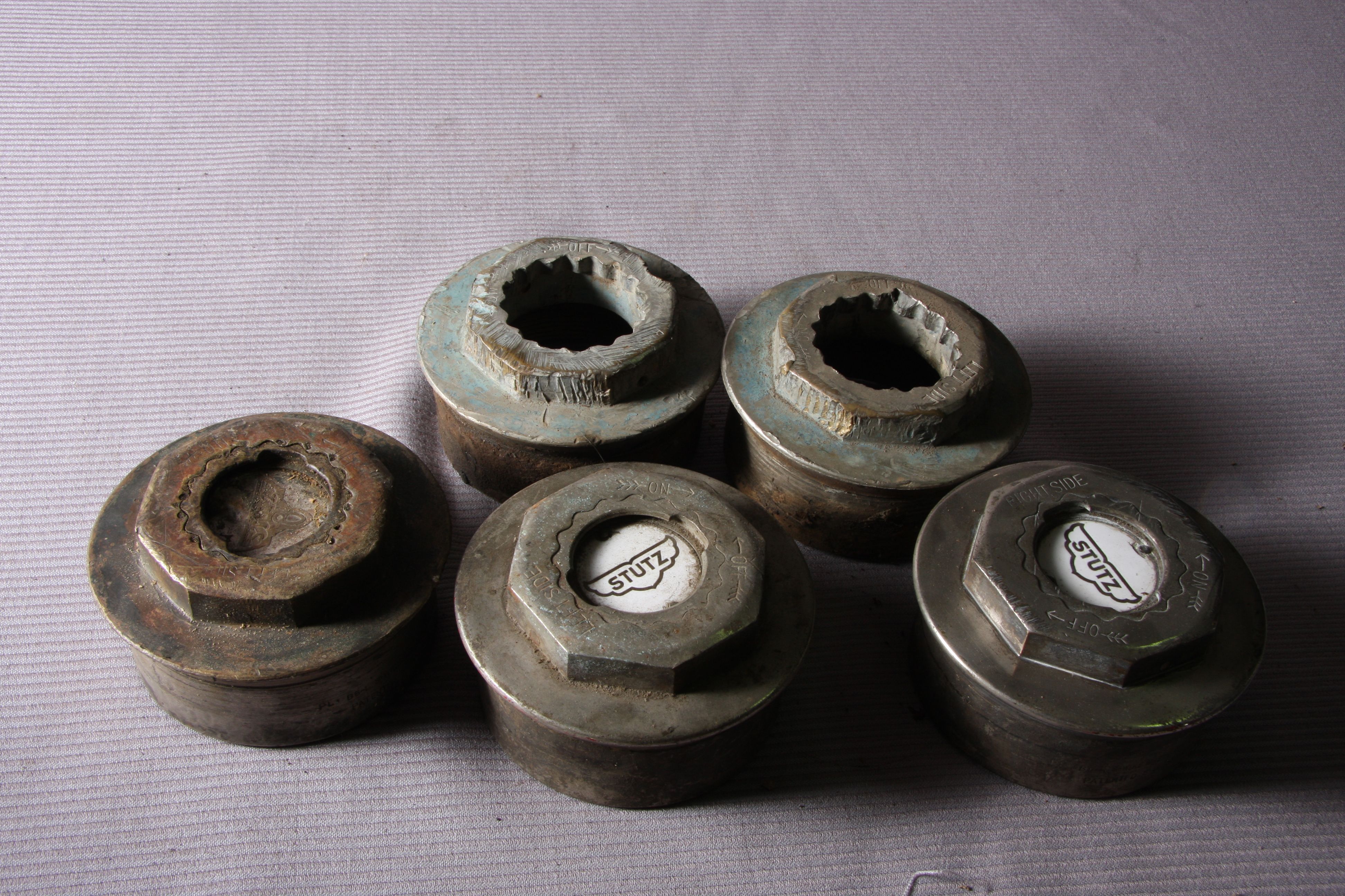 Bonhams Cars : A set of five Stutz Buffalo hub caps,