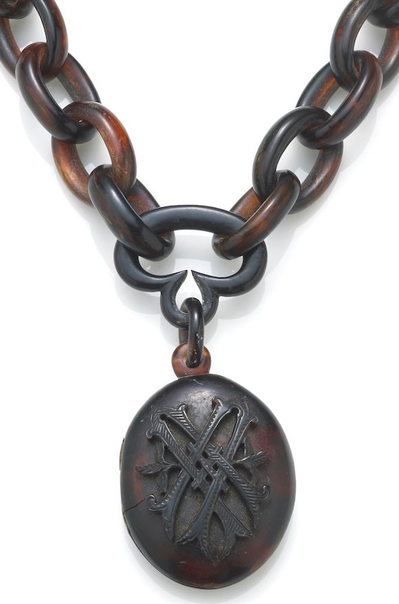 Bonhams : A tortoise shell necklace and locket