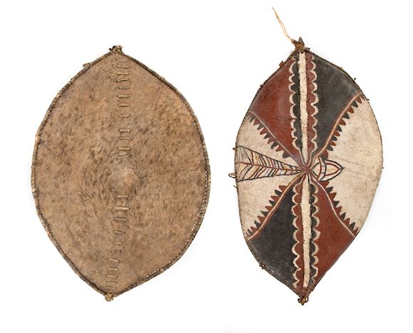 Bonhams : A Masai hide shield and another African hide shield