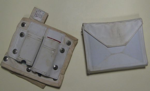 Bonhams : SPACE SUIT REPAIR KIT AND BIOBELT POUCH.