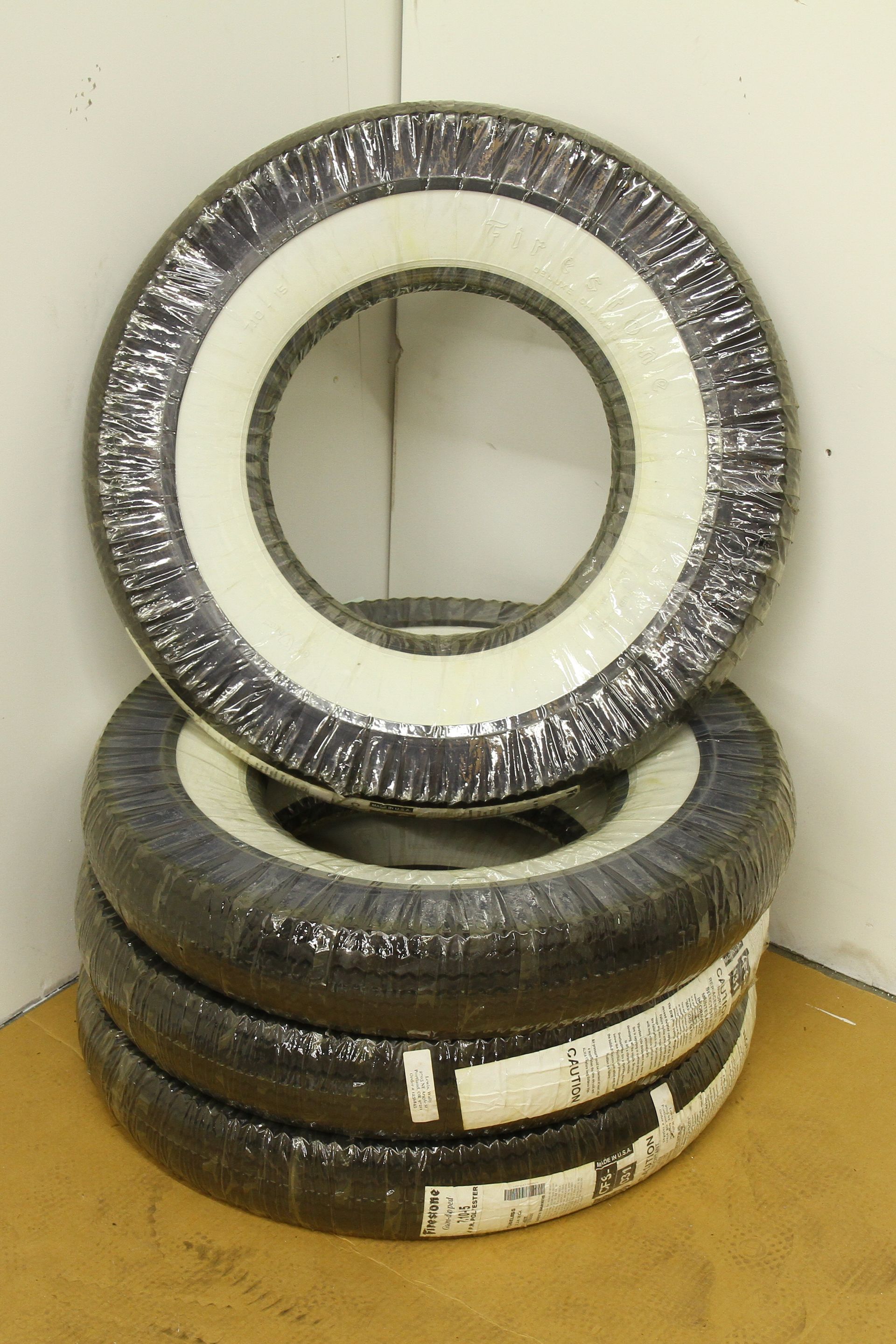 Bonhams Cars : A set of four 7.10-15 Firestone white wall tires,