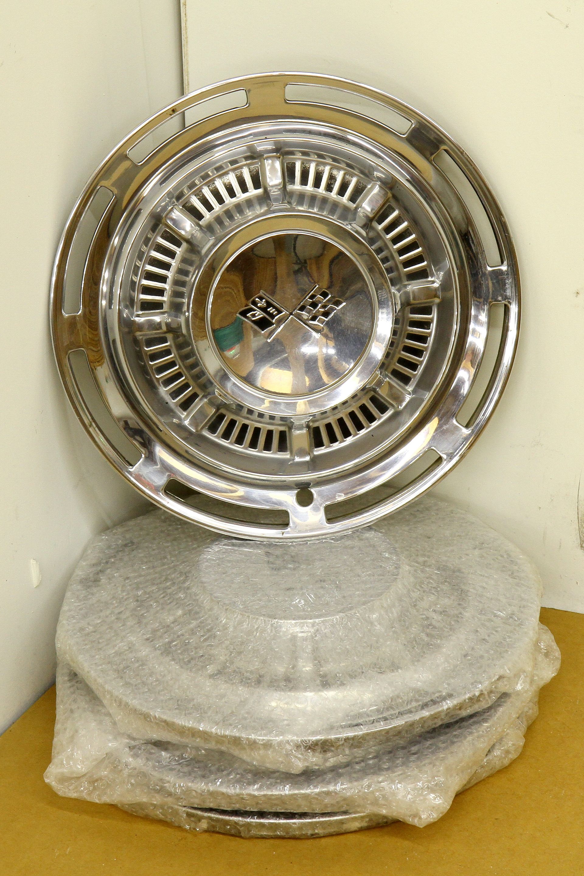 Bonhams Cars : A set of four 14" Chevrolet Impala hubcaps,