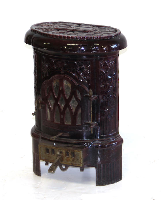Bonhams A French Glazed Ceramic And Iron Warming Stove Lilyver Deville Et Cie