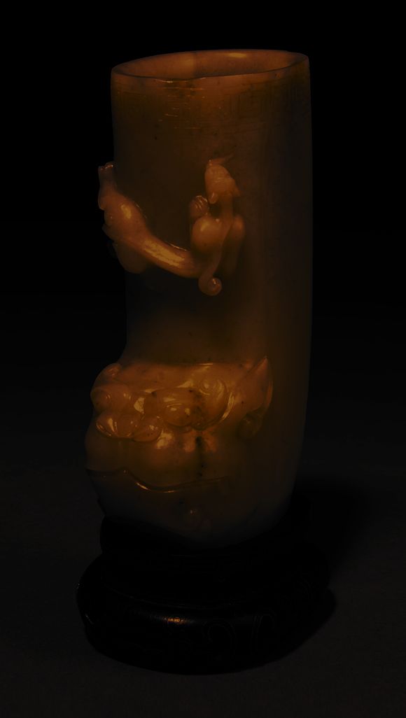 Bonhams : A pale greenish white jade rhyton cup 20th century