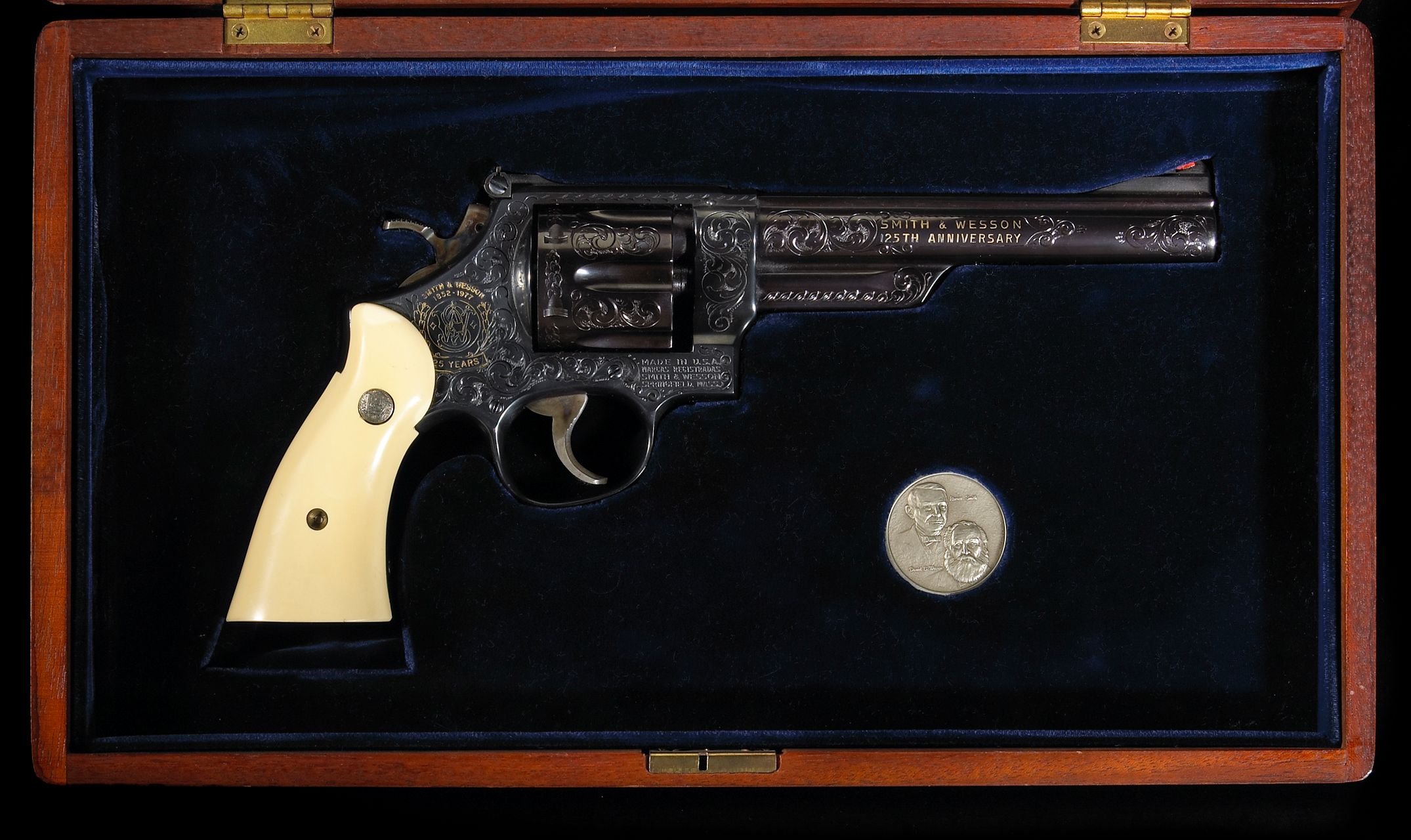 A cased and factory engraved Smith & Wesson 125 Anniversary ...