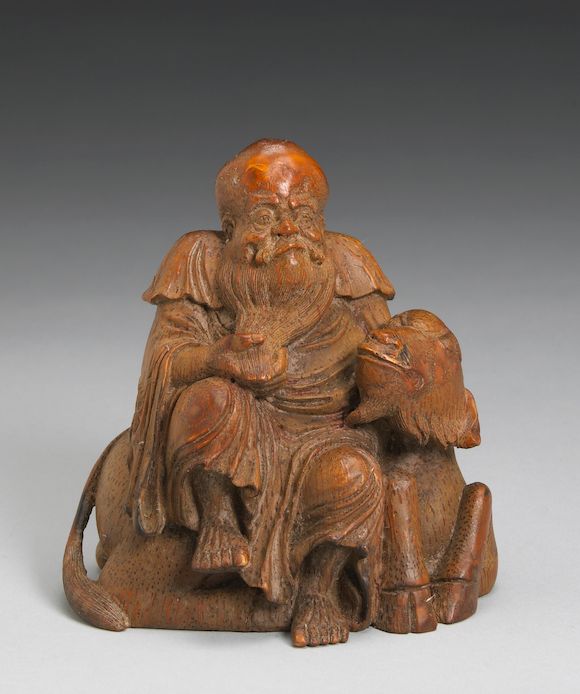 Bonhams : A carved bamboo immortal on a ram