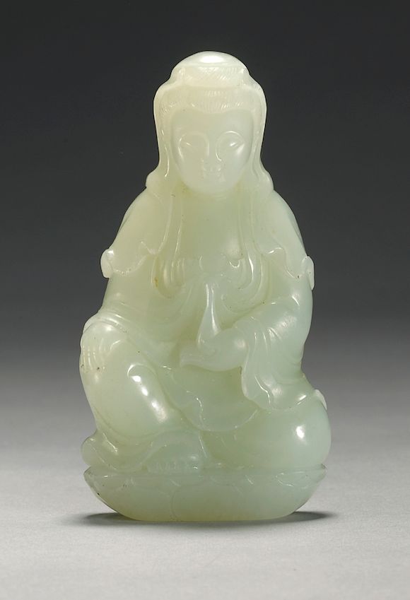 Bonhams : A small white jade figure of Guanyin