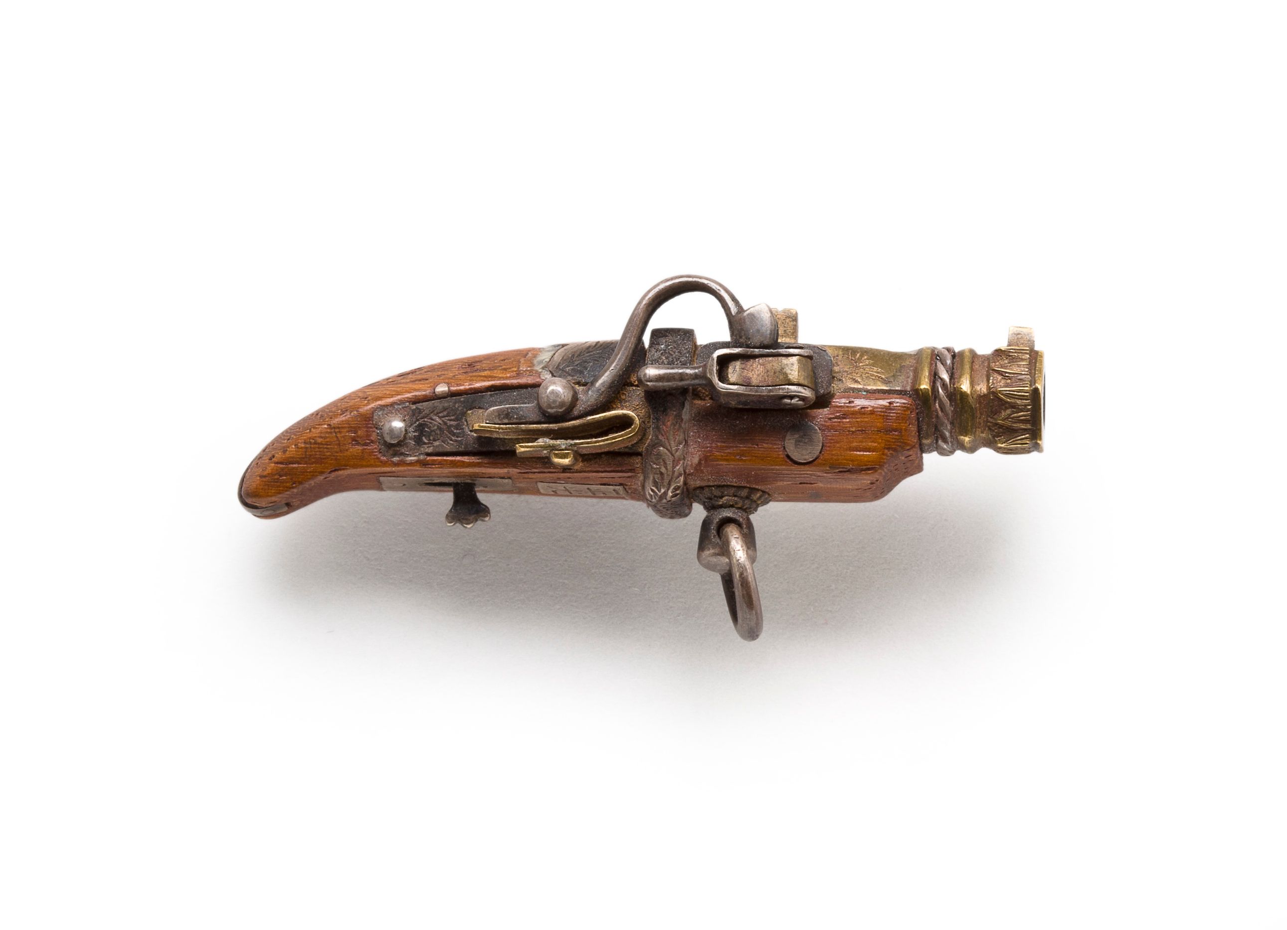 Bonhams : A wood and brass netsuke of a matchlock pistol By Masamitsu ...