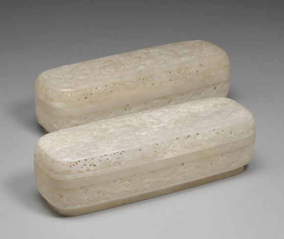 Bonhams : A pair of reticulated white jade rectangular covered boxes