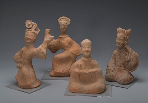 Bonhams : An assembled group of four large red pottery funerary figures ...