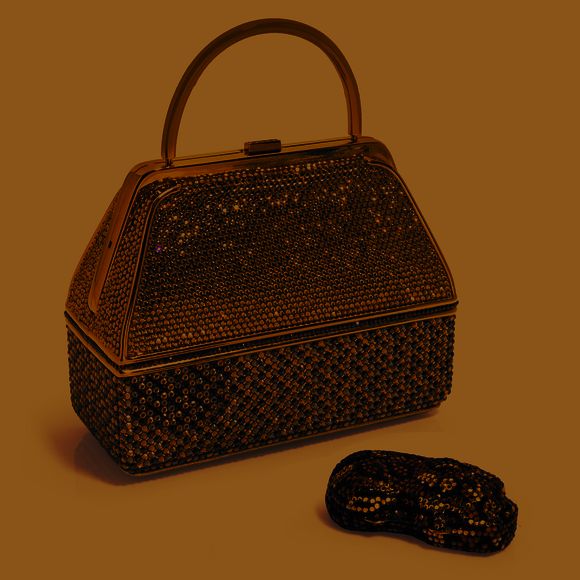 Bonhams : A gold and brown crystal purse together with a crystal laying ...